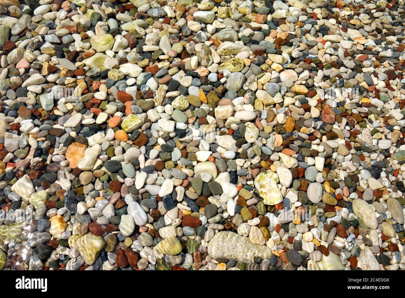 Lots of colorful pebbles from a sea shore for backgrounds Stock Photo ...