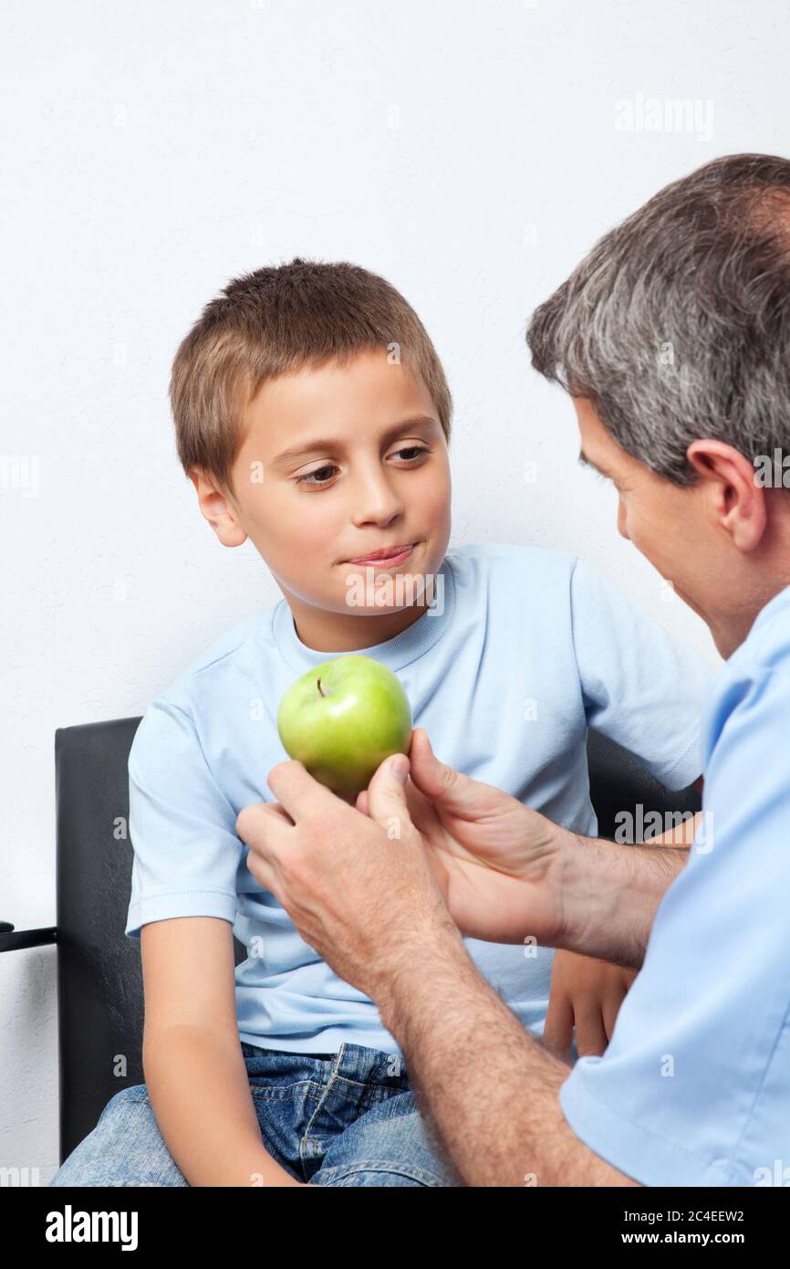 Dentist gives treatment hi-res stock photography and images - Alamy