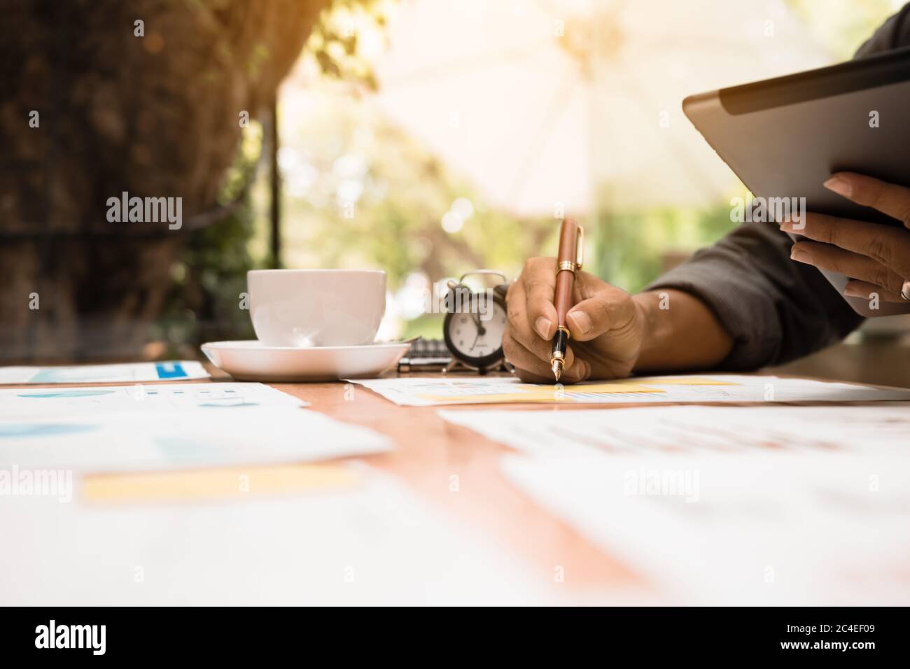 Business entrepreneur coffee shop writing making note and doing ...