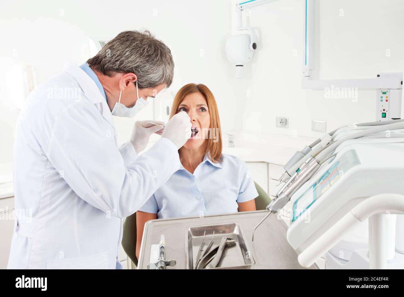 Woman having her checkup at the dentist Stock Photo - Alamy