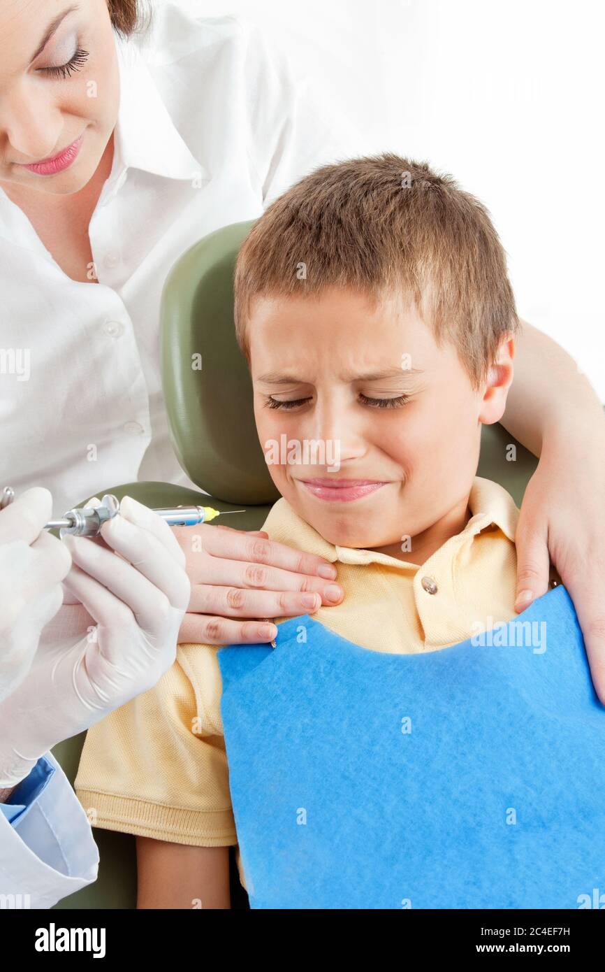 Child at the dentist is afraid of an injection Stock Photo - Alamy
