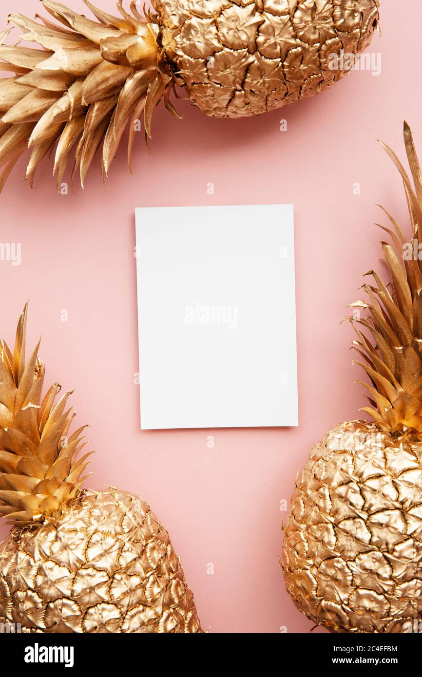 Gold pineapple minimal flat lay with a blank white card Stock Photo - Alamy