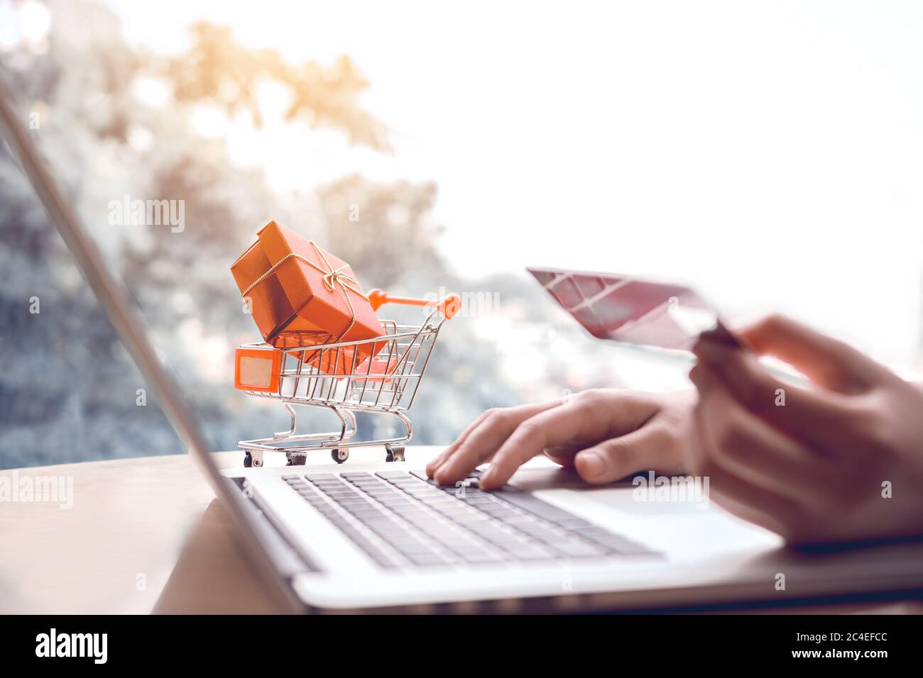 Online shopping concept with woman hand using laptop and looking credit ...