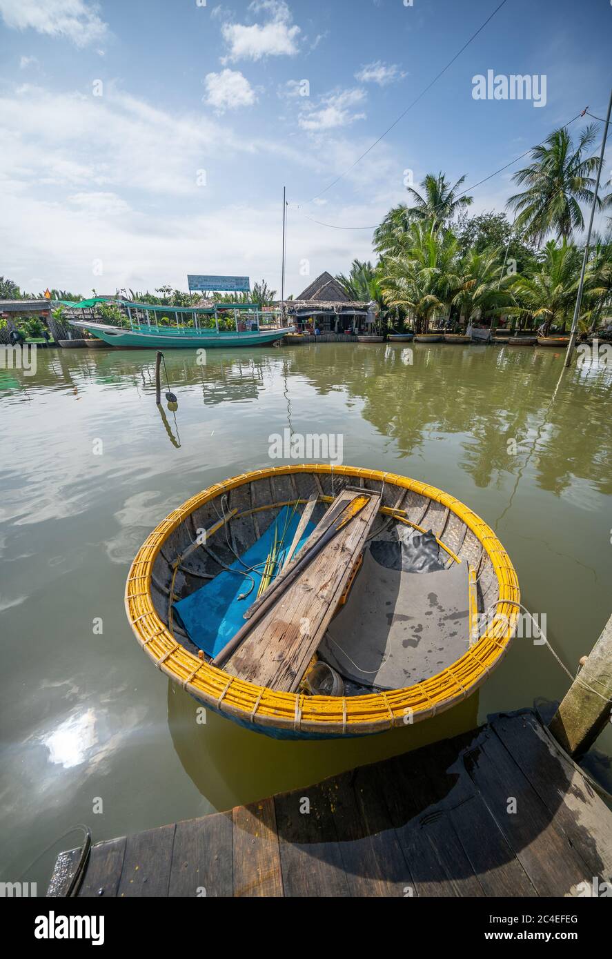 Vertical shot of a Vietnamese round boat in the lake Stock Photo - Alamy