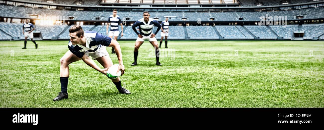 Digital composite image of rugby player throwing the ball in sports ...