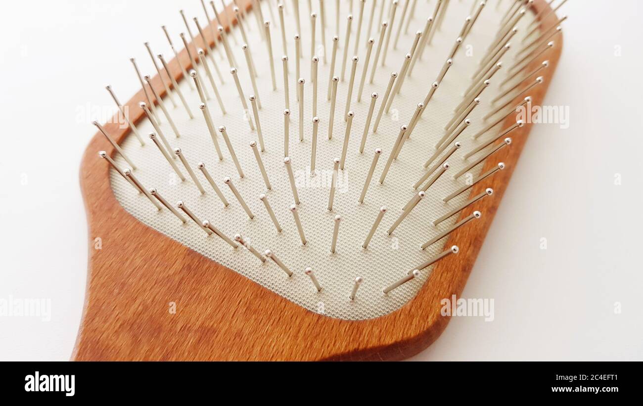 Wooden massage hair brush with iron bristles, macro side view Stock ...
