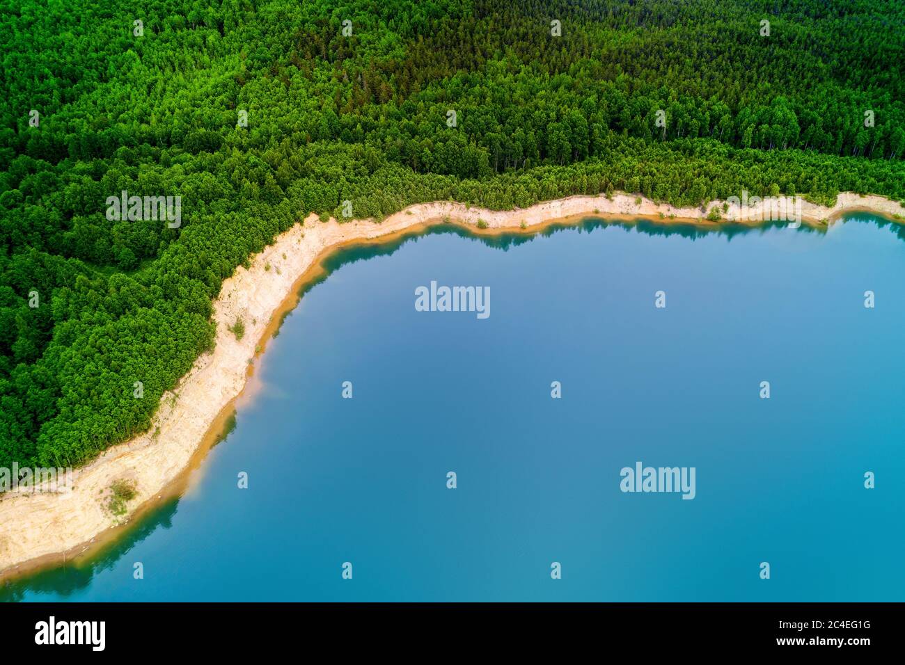 Idyllic turquoise colored lake in the forest. Panoramic aerial ...