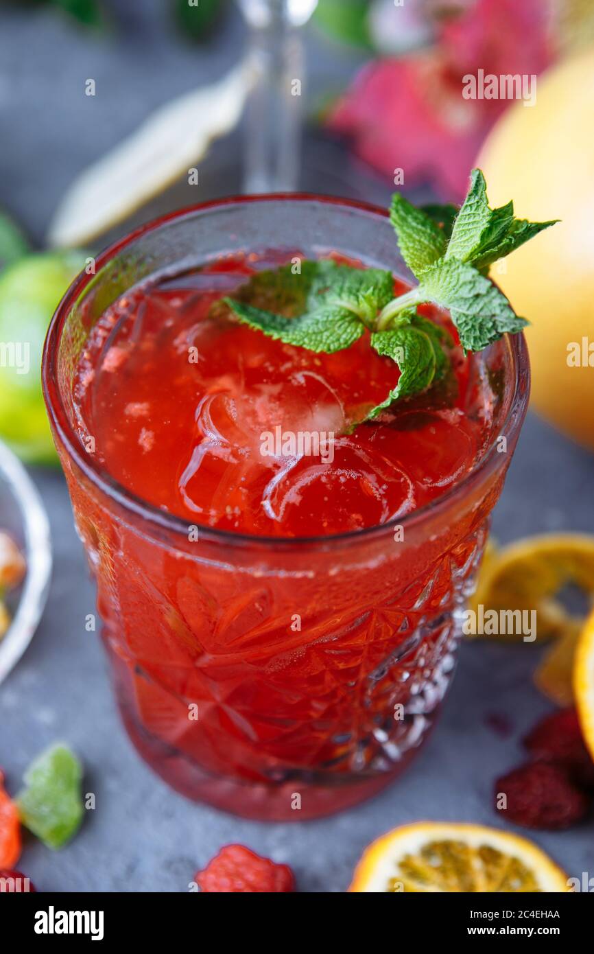 Fresh pink lemonade with raspberries decorated with mint leaves, orange ...