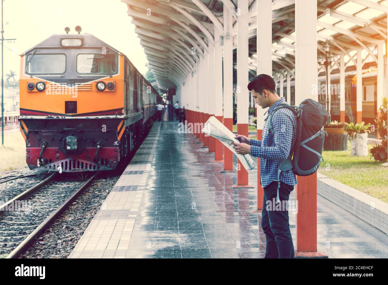 Asian man hand holding map and looking explore data route Stock Photo ...
