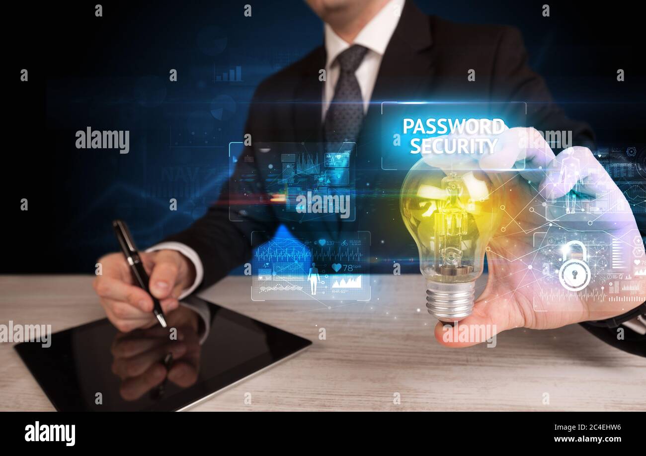 Businessman holding lightbulb with PASSWORD SECURITY inscription ...