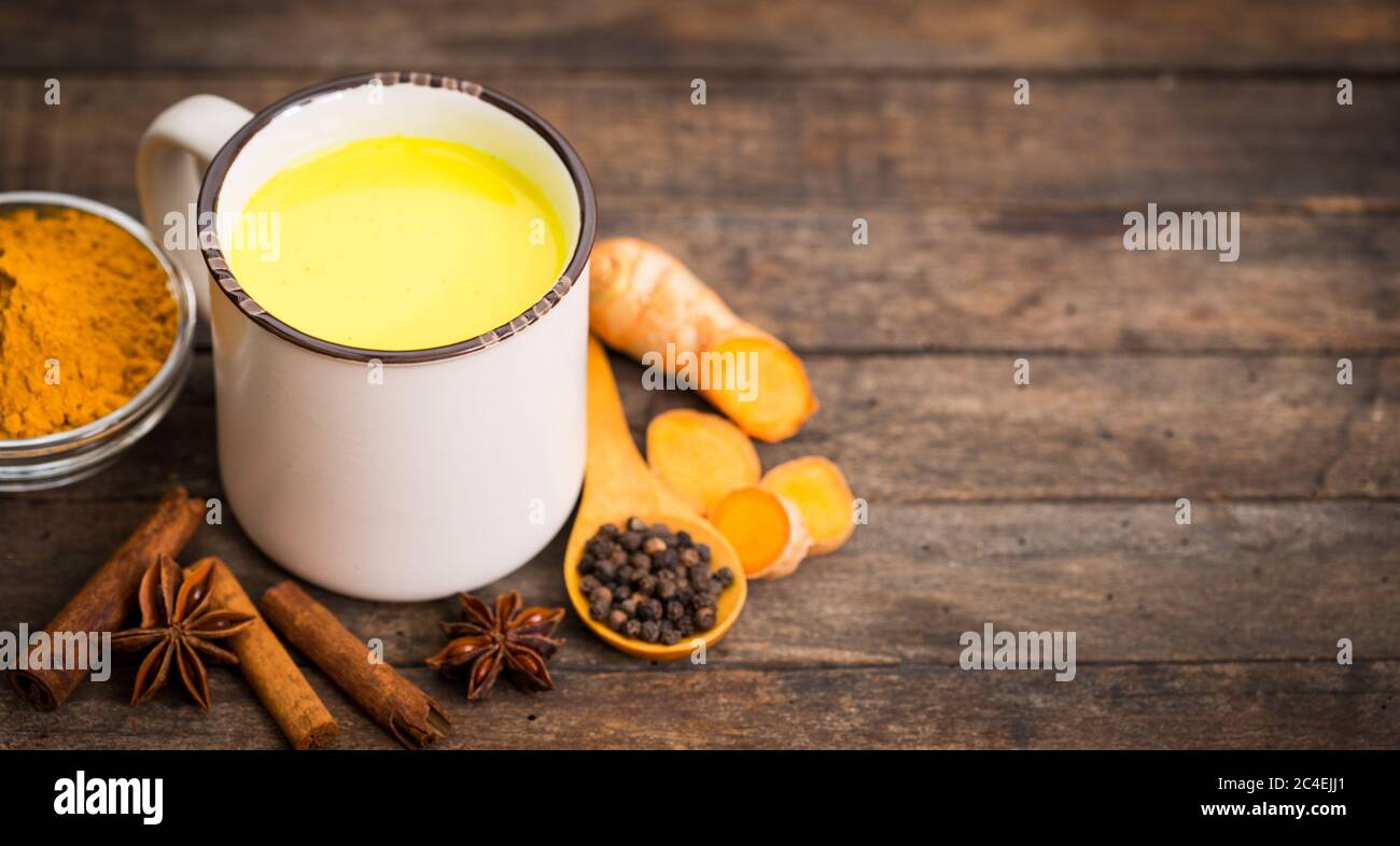 Turmeric golden milk latte with honey and cinnamon Stock Photo - Alamy