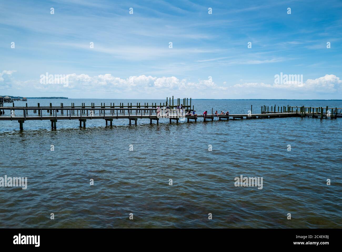 Duck, North Carolina, USA -- June 9, 2020. A photo of people fishing ...