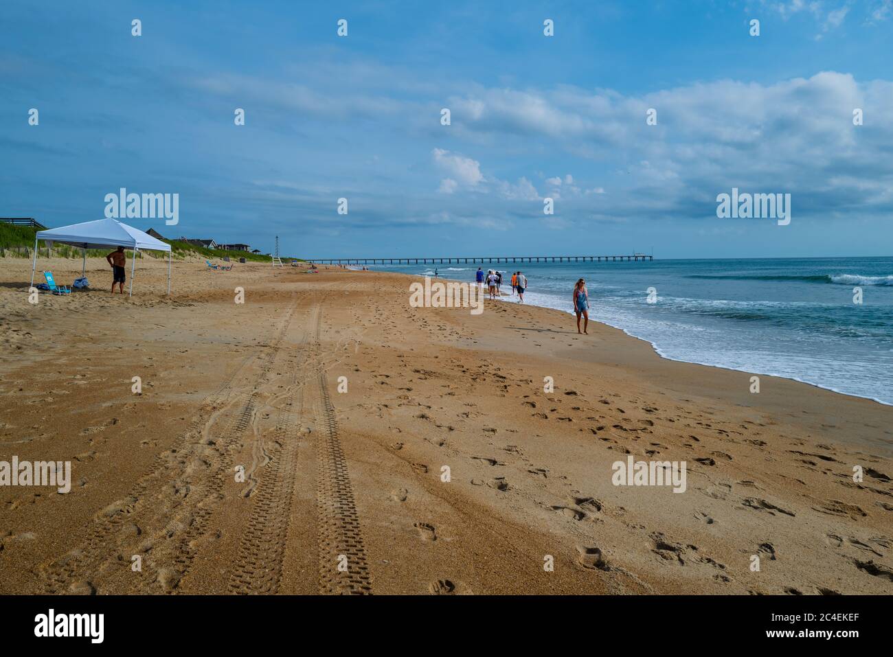 Duck, North Carolina, USA -- June 9, 2020. A wide angle photo of people ...
