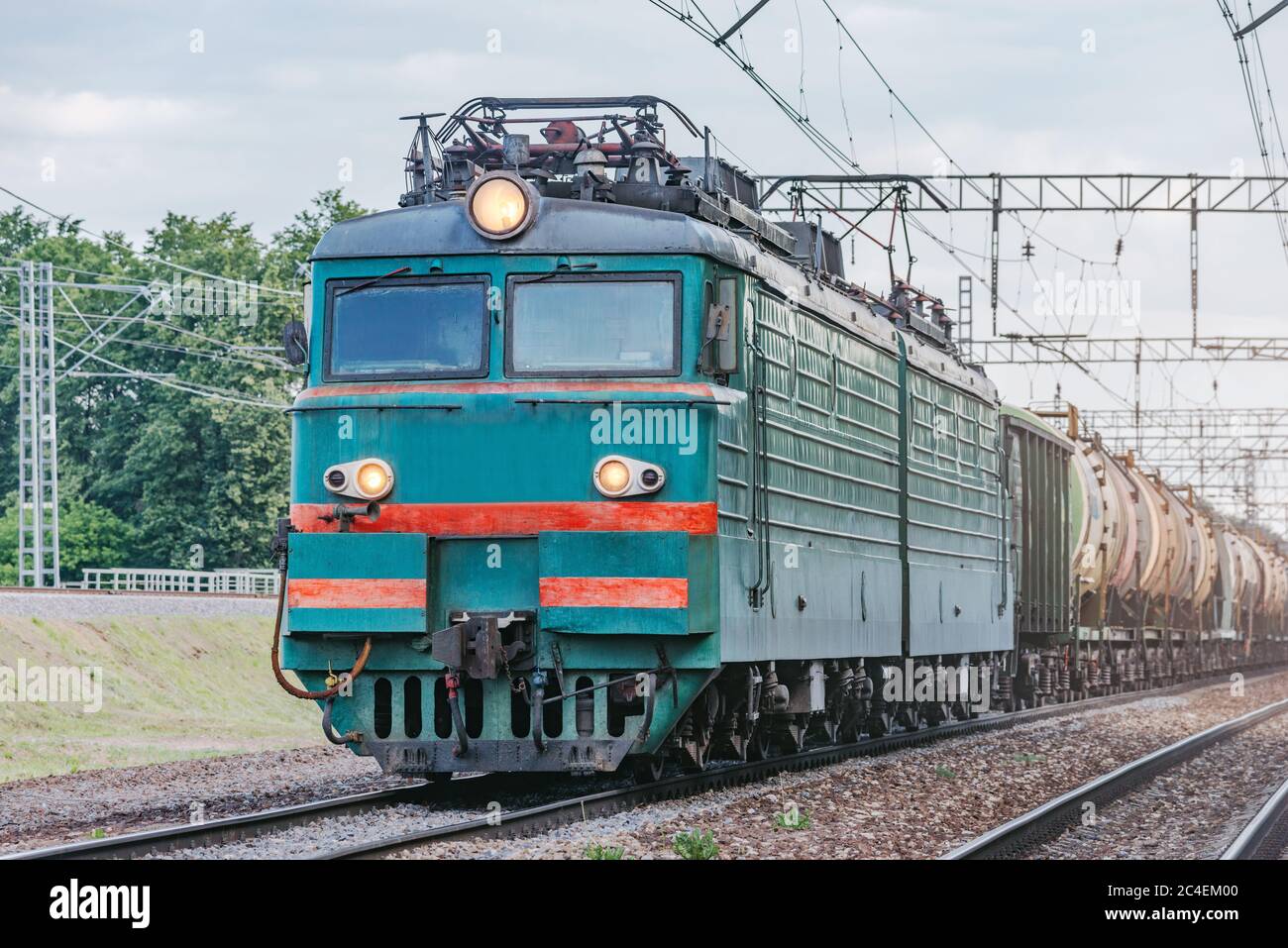 Freight train with oil approaches to the station Stock Photo - Alamy