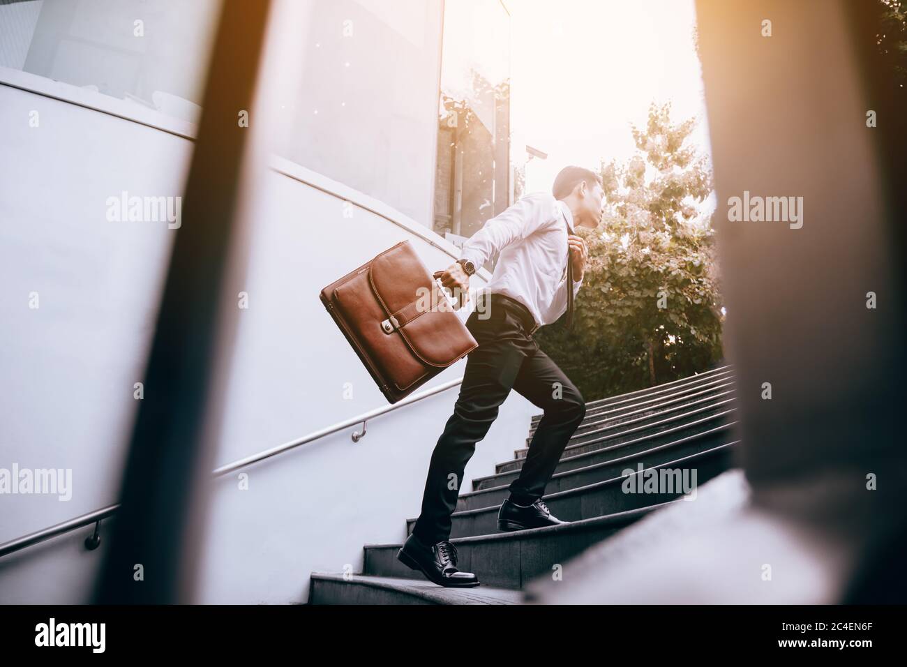 Man running steps suit hi-res stock photography and images - Alamy