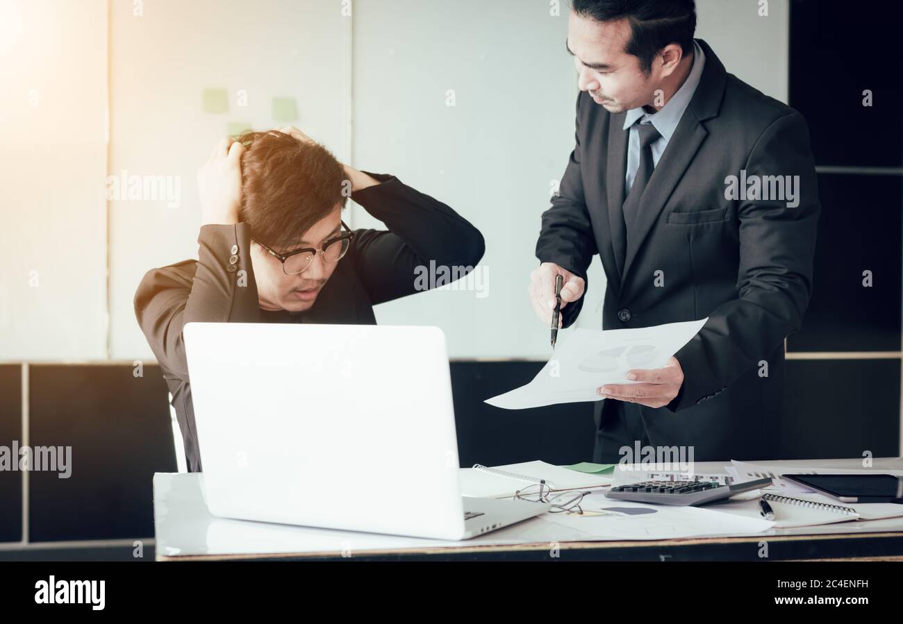 Boss reprimanding an employee in an office Stock Photo - Alamy