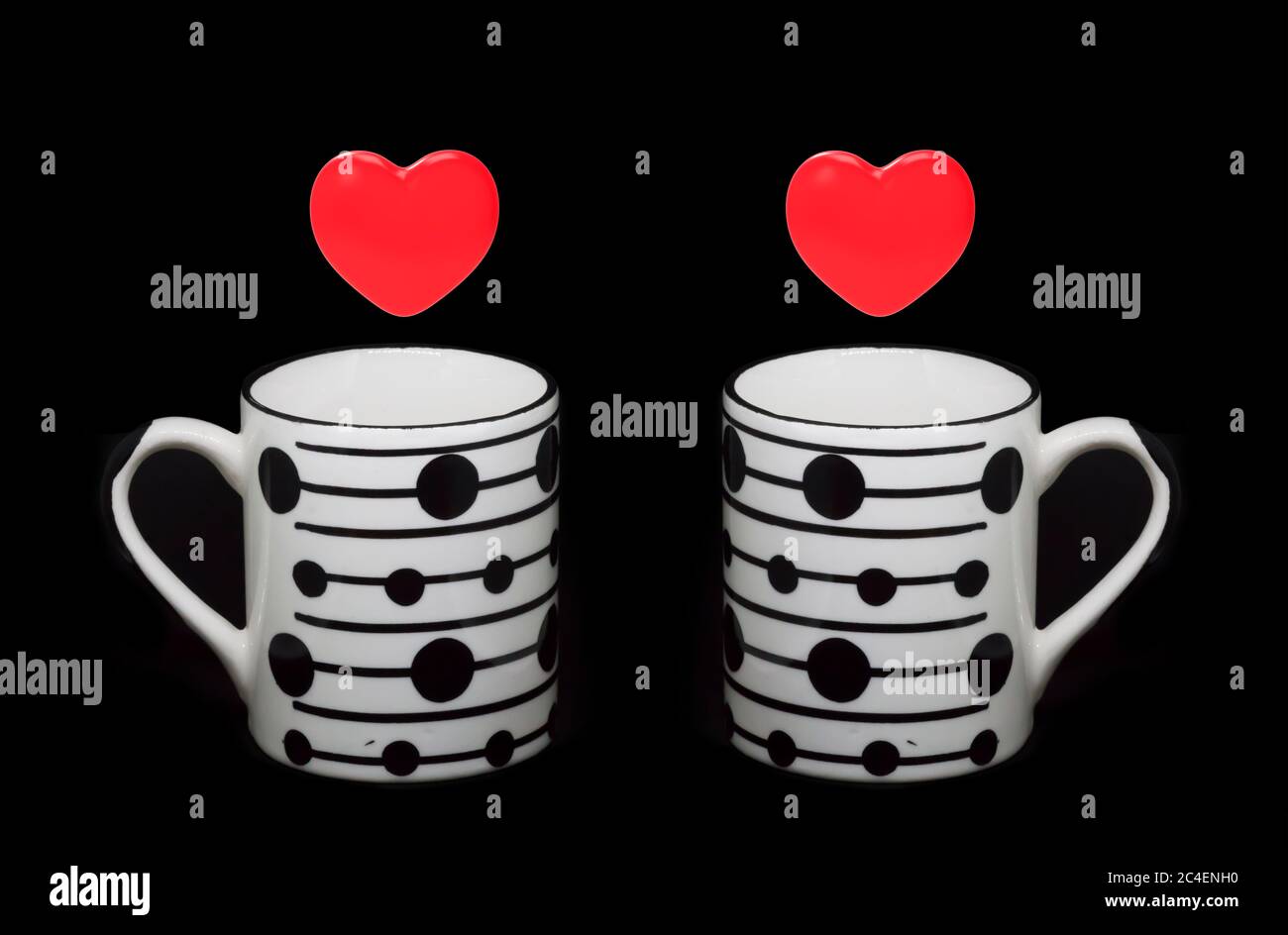Coffee cups with two Love heart symbols Stock Photo - Alamy