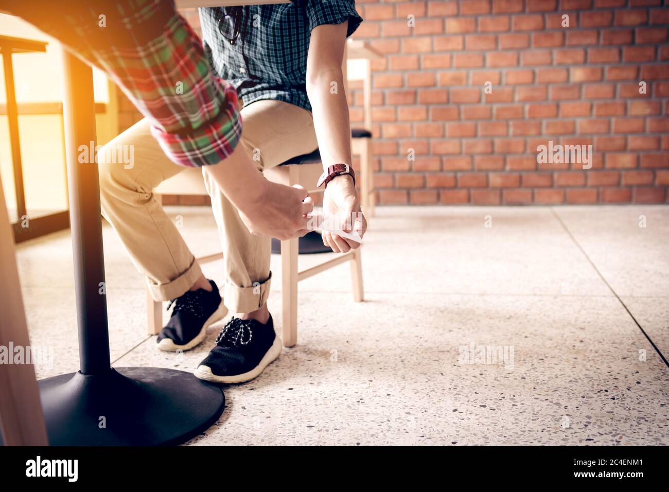 Two school hand passing notes to each other secretly during class Stock ...