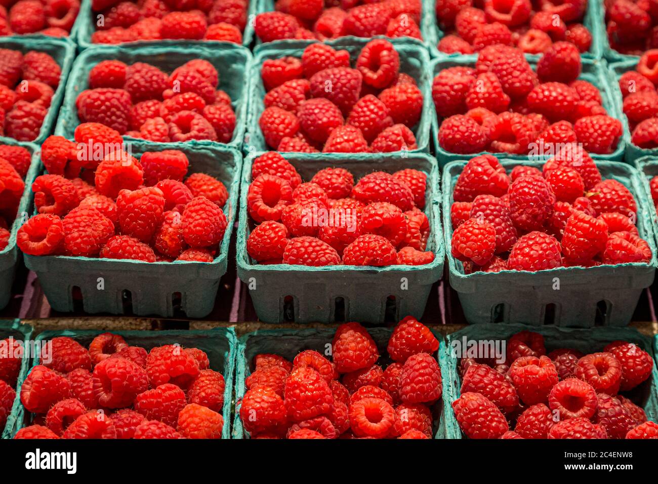 A display of raspberries for sale on a market stall Stock Photo - Alamy