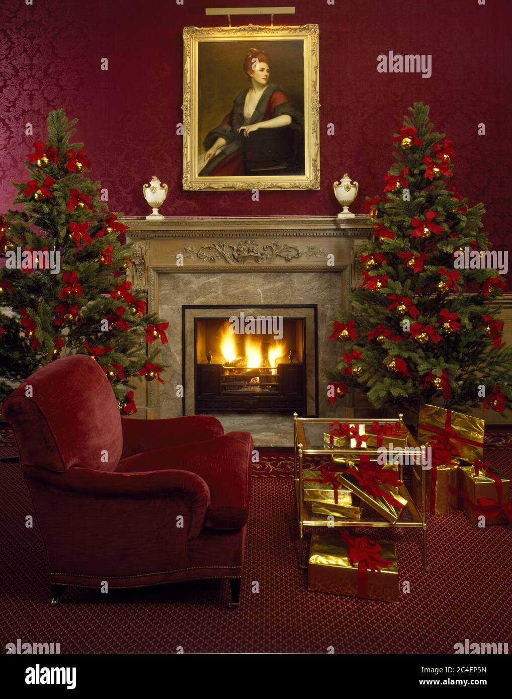 Well-lit portrait over mantlepiece with open fire at Christmas time ...