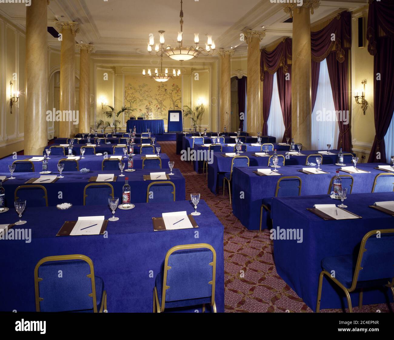 Blue cloths on tables in conference hall with classical pillars Stock ...
