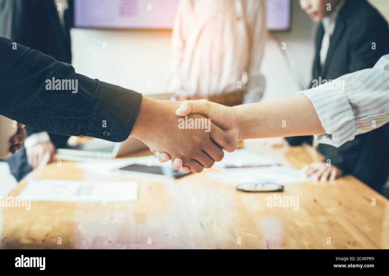 Team of entrepreneurs collaborating in a modern office Stock Photo - Alamy