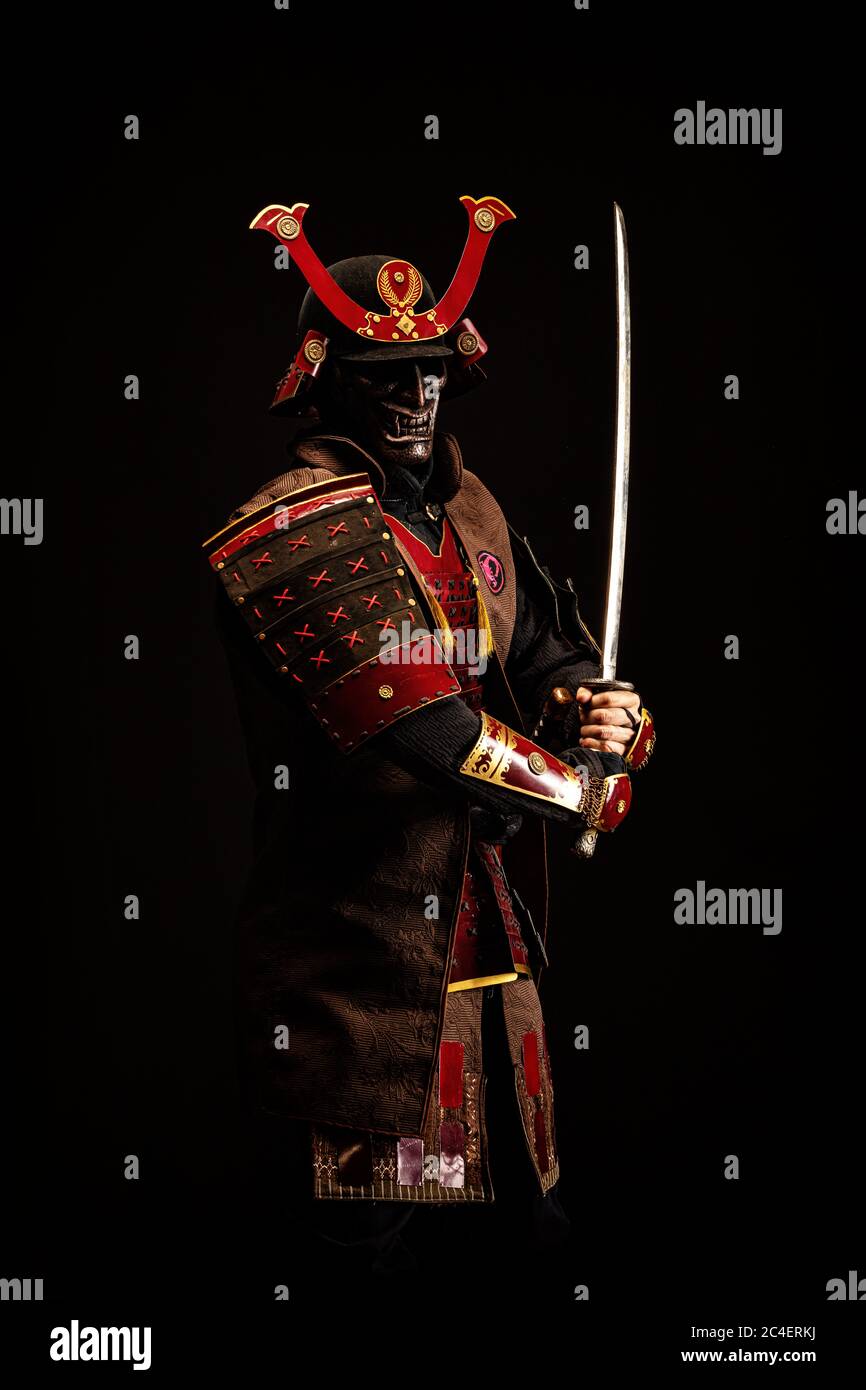 Portrait of a samurai in armor in attack position Stock Photo - Alamy