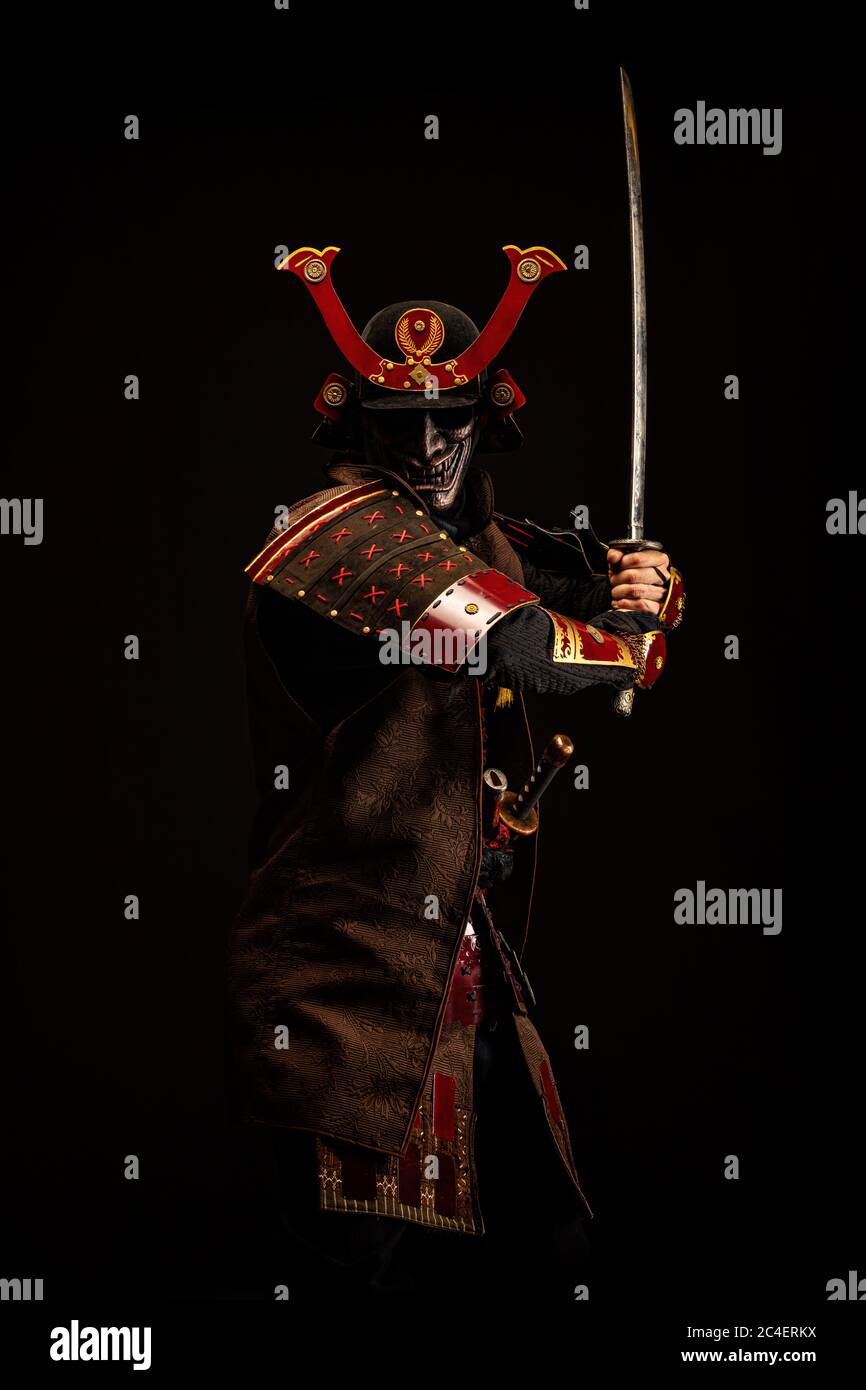 Portrait of a samurai in armor in attack position Stock Photo - Alamy