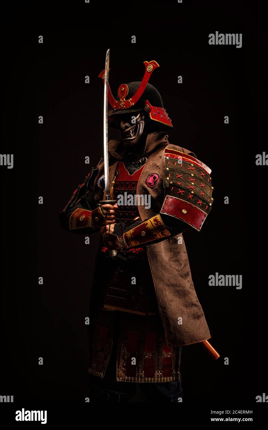 Portrait of a samurai in armor in attack position Stock Photo - Alamy
