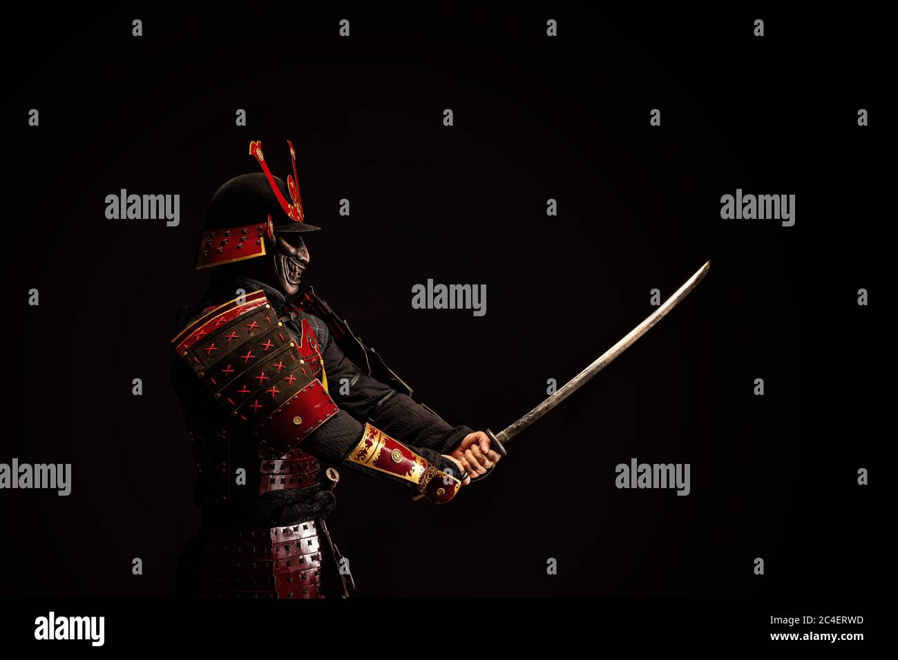 Portrait of a samurai in armor in attack position Stock Photo - Alamy