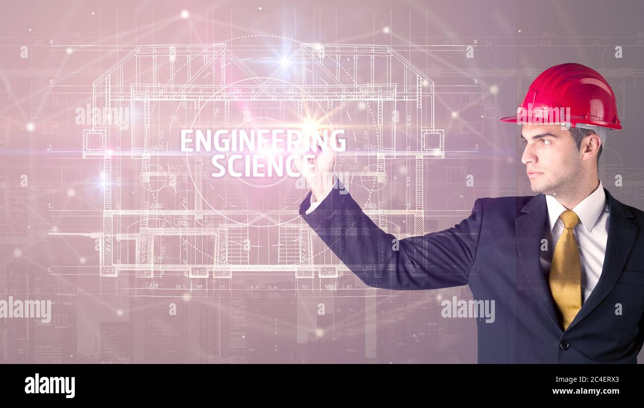 Handsome architect with helmet drawing ENGINEERING SCIENCE inscription ...