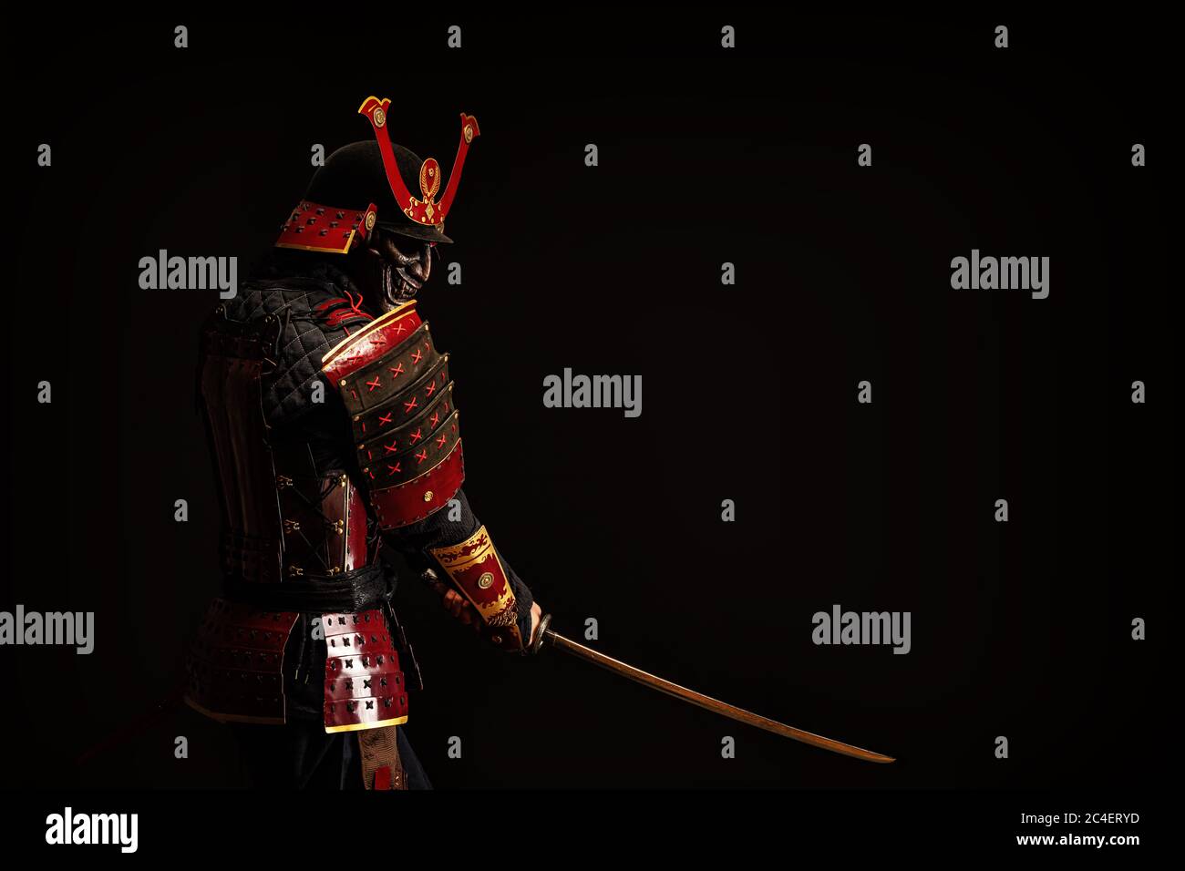 Portrait of a samurai in armor in attack position Stock Photo - Alamy