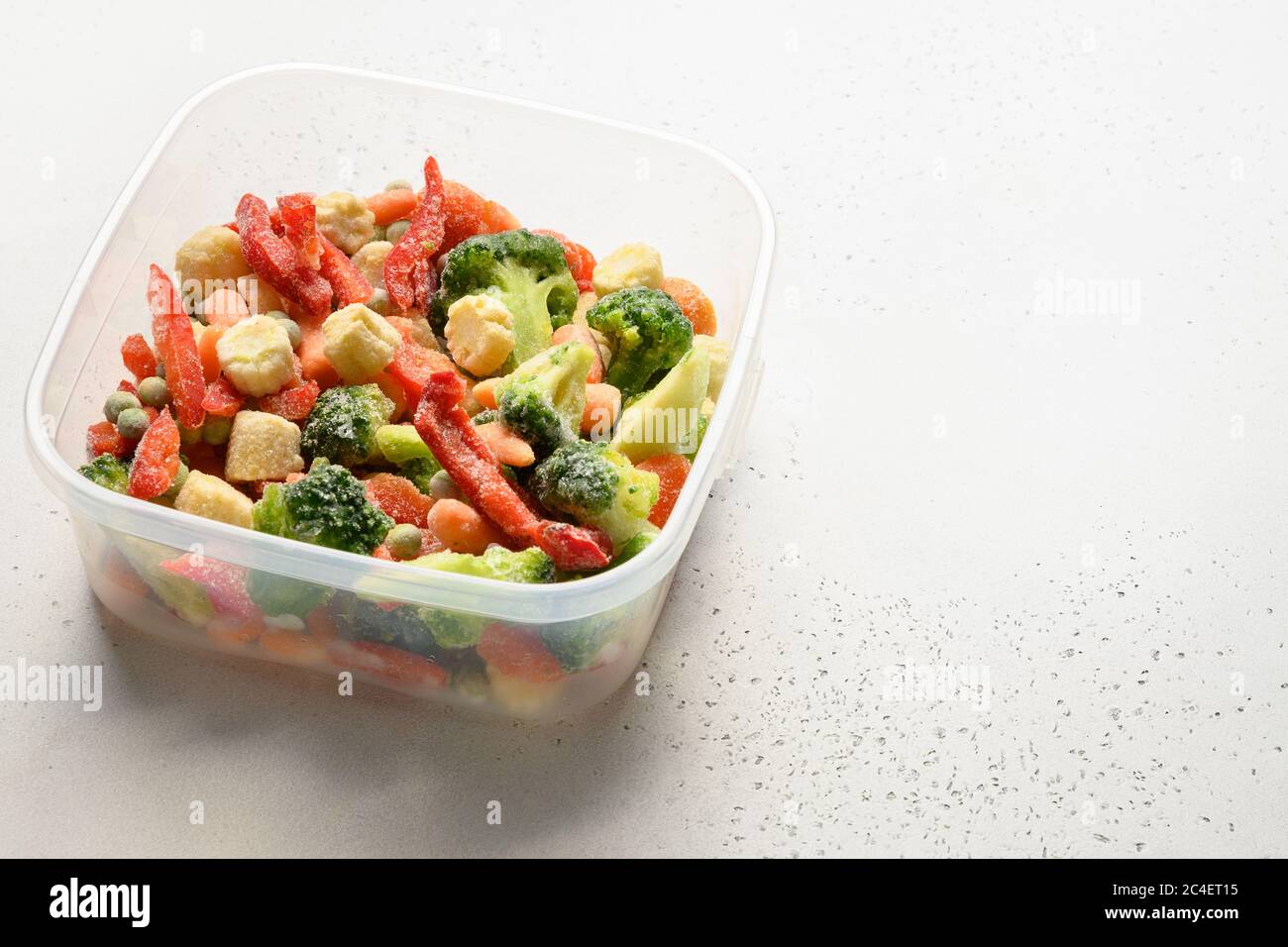 Frozen food vegetables on white background Close up. Copy space Stock ...