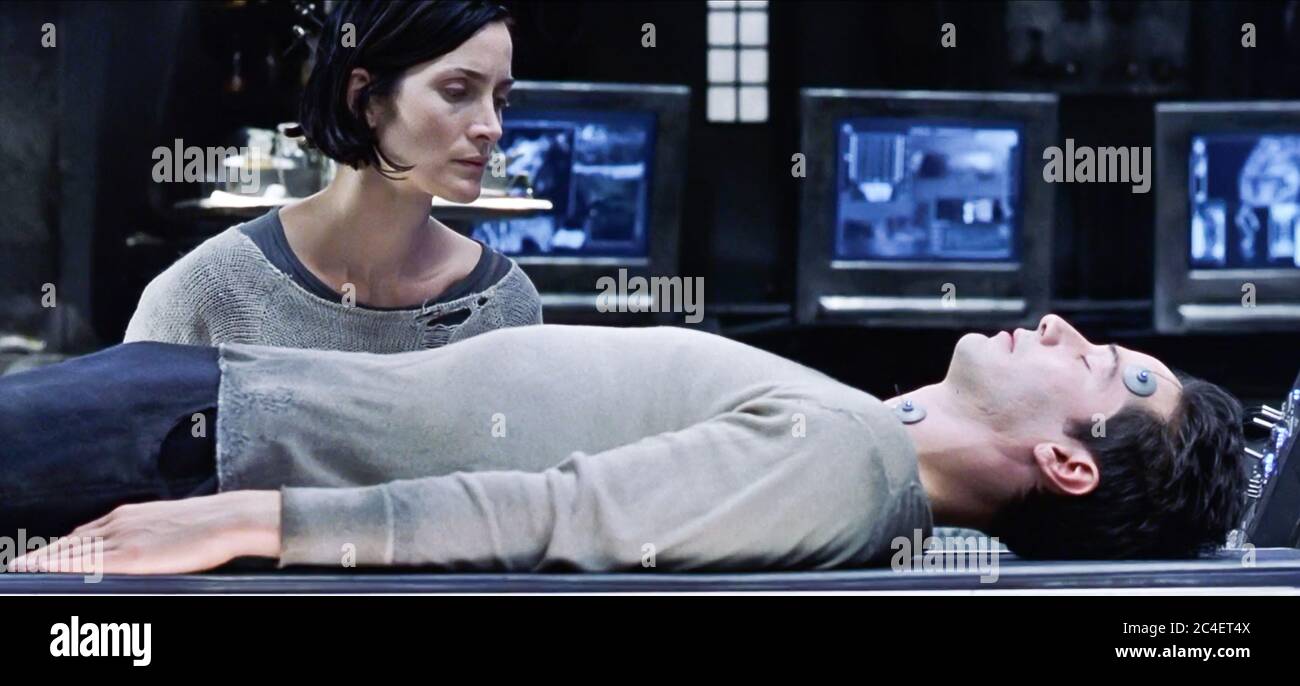 USA. Keanu Reeves and Carrie-Anne Moss in a scene from the ©Warner Bros ...