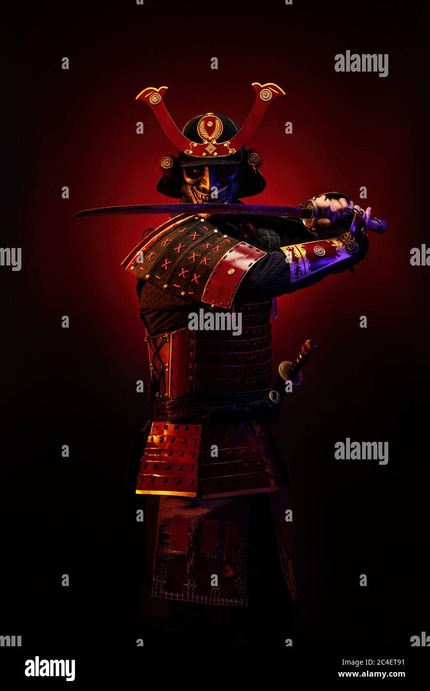 Portrait of a samurai in red armor on guard Stock Photo - Alamy