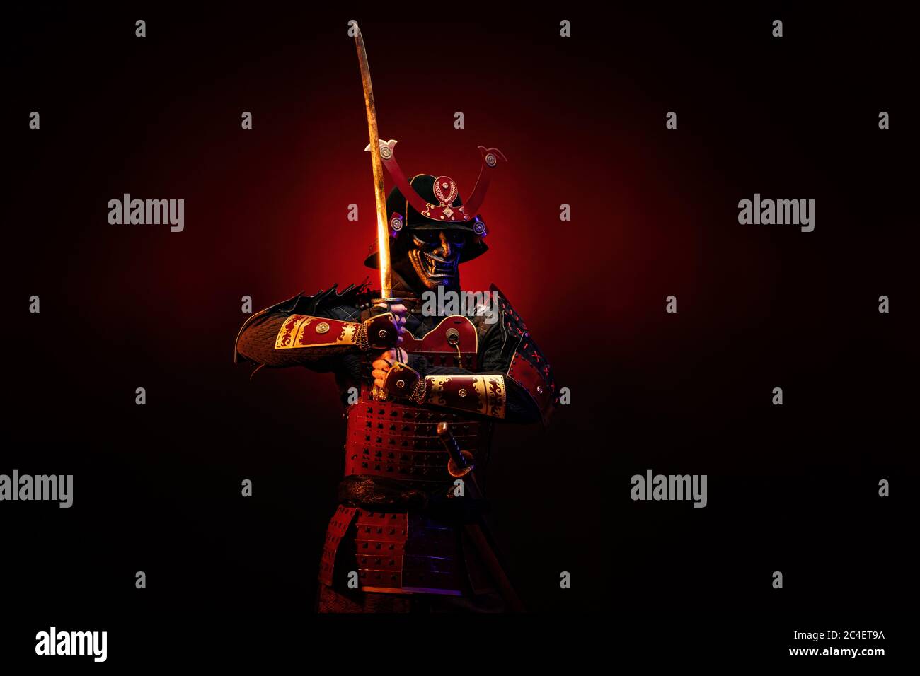 Portrait of a samurai in red armor on guard Stock Photo - Alamy