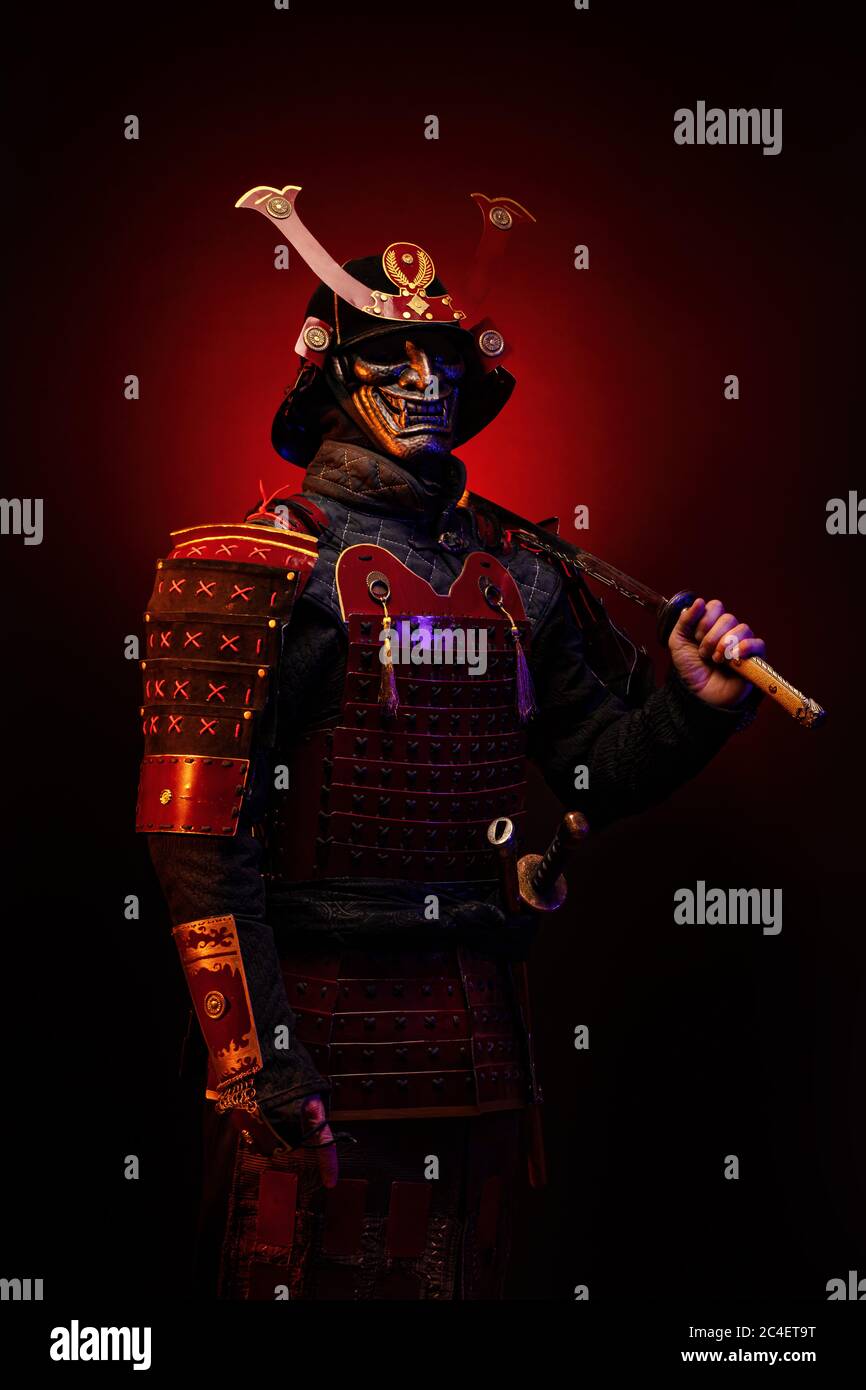 Portrait of a samurai in red armor in profile, his katana on his ...