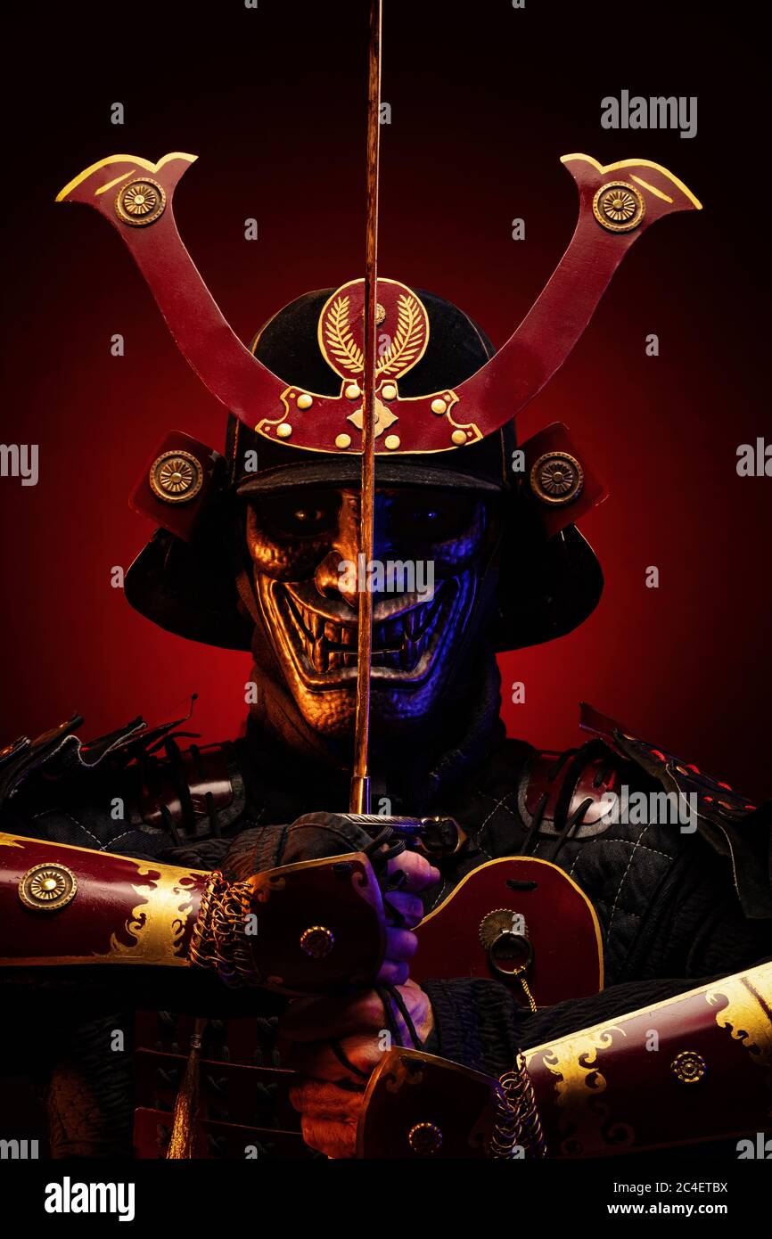 Portrait of a samurai in red armor on guard Stock Photo - Alamy