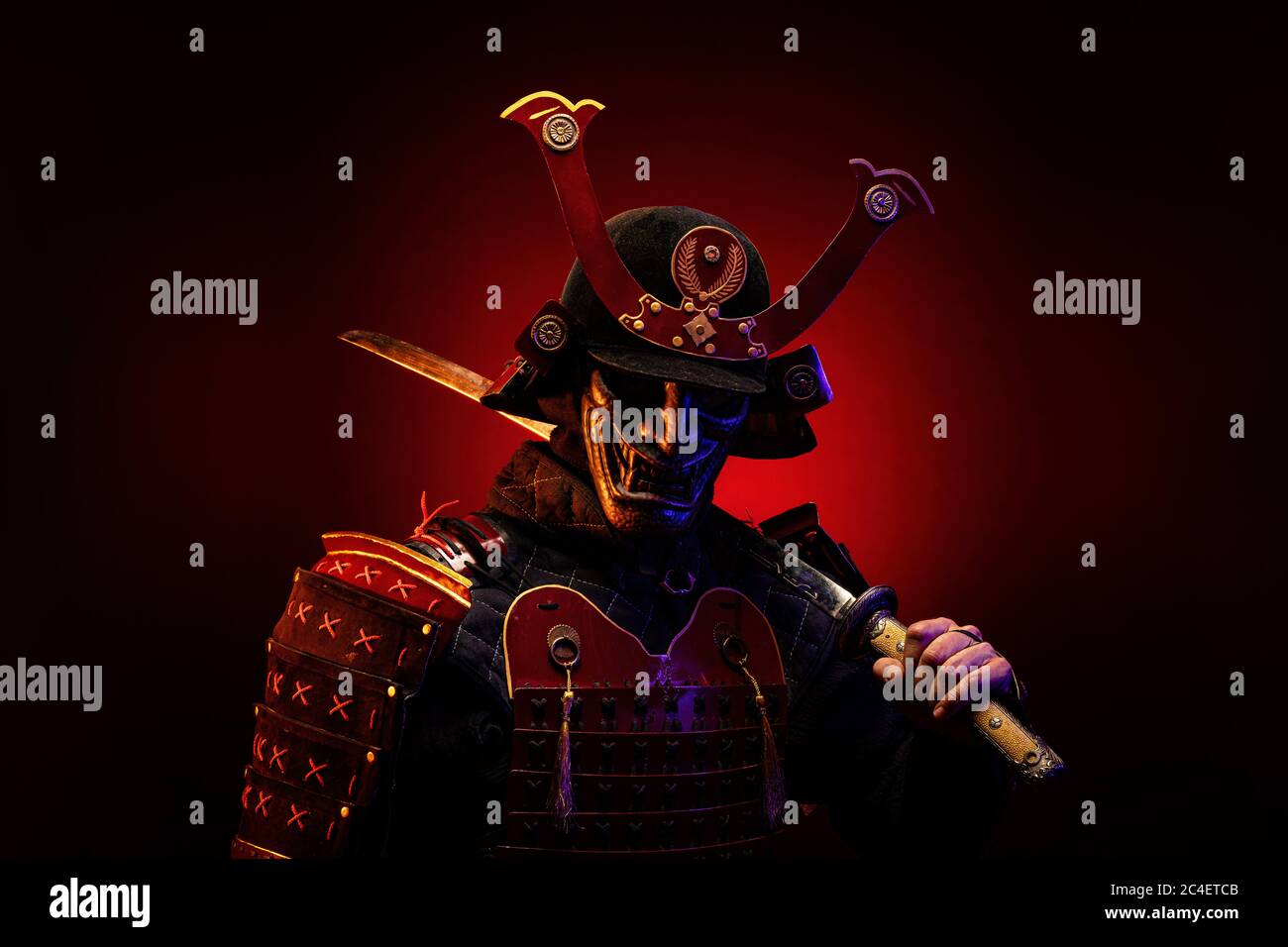 Portrait of a samurai in red armor in profile, his katana on his ...