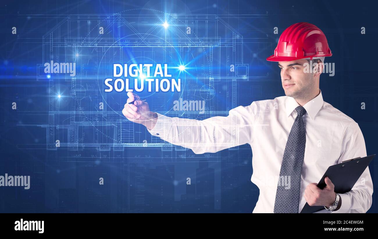 Handsome architect with helmet drawing DIGITAL SOLUTION inscription ...