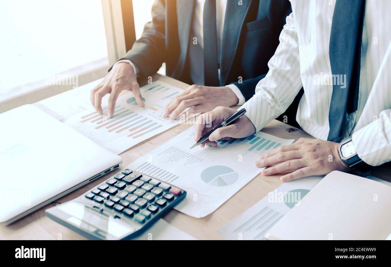 Two business people analysis graph report in the office room Stock ...