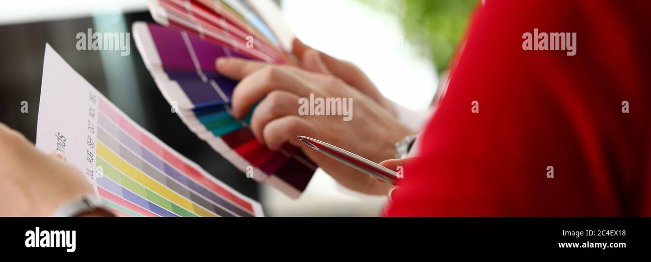 Design agency workers choosing color for walls Stock Photo - Alamy