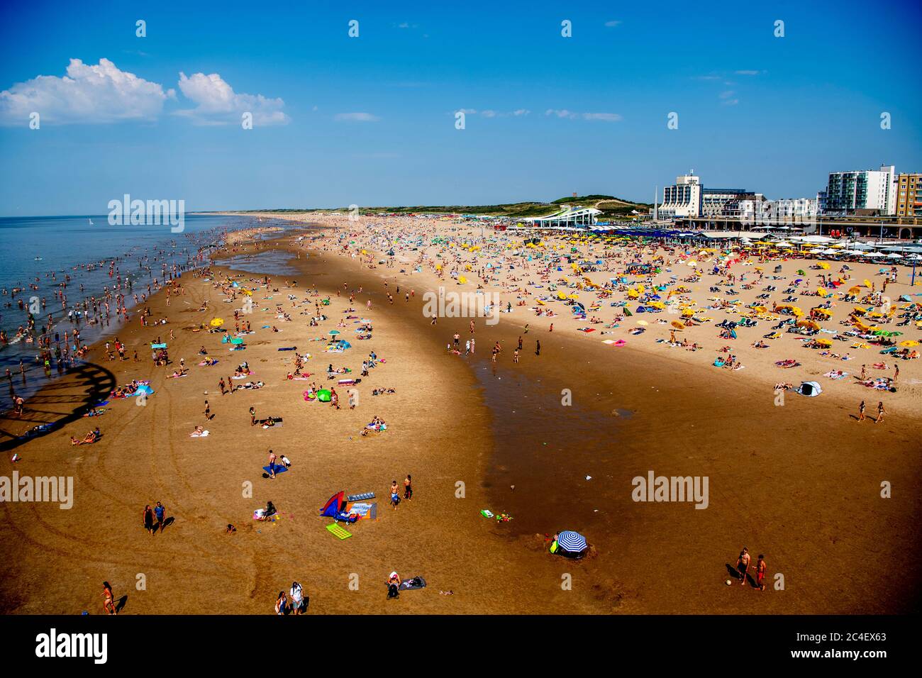 People enjoy the sun and the warm weather during the heat wave at a ...