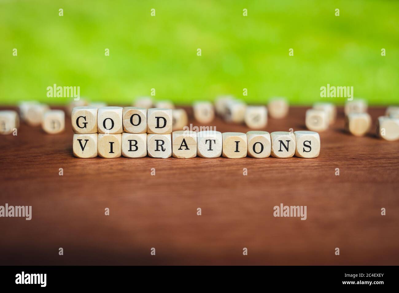 Closeup of isolated dices on a table showing the words good vibrations ...