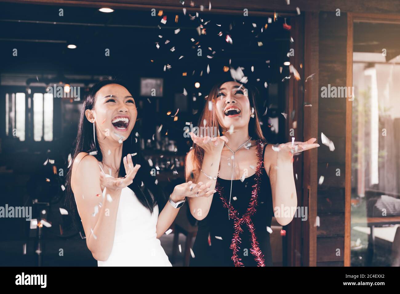 Asian female celebration in home Stock Photo - Alamy