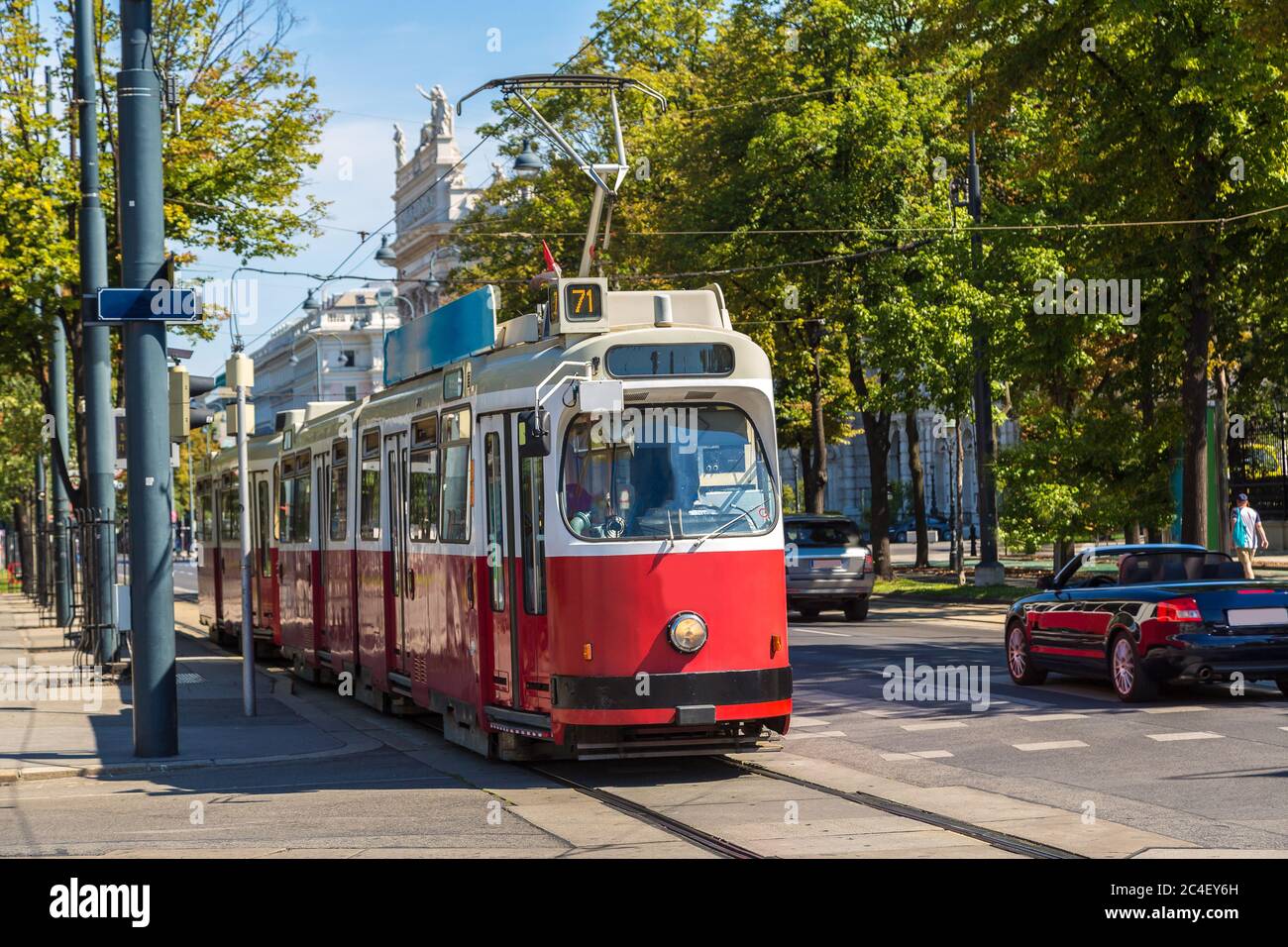 Traditional red electric tram in Vienna, Austria in a beautiful summer ...