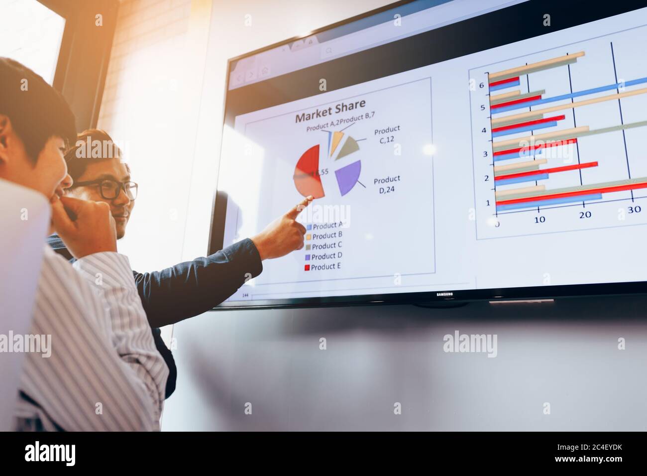 Close up two business people analysis chart working together at meeting ...