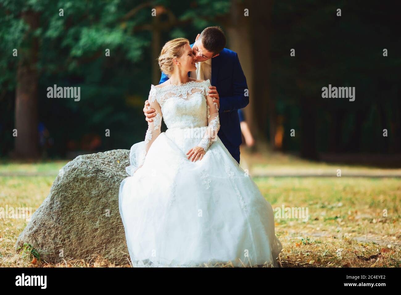 beautiful bride in an expensive dress walking in the woods in nature ...