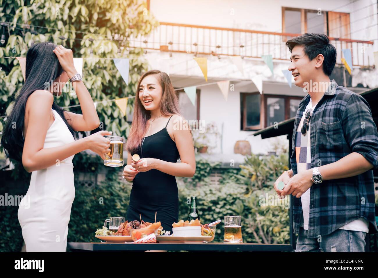 Asian people enjoy party together on weekend in garden Stock Photo - Alamy