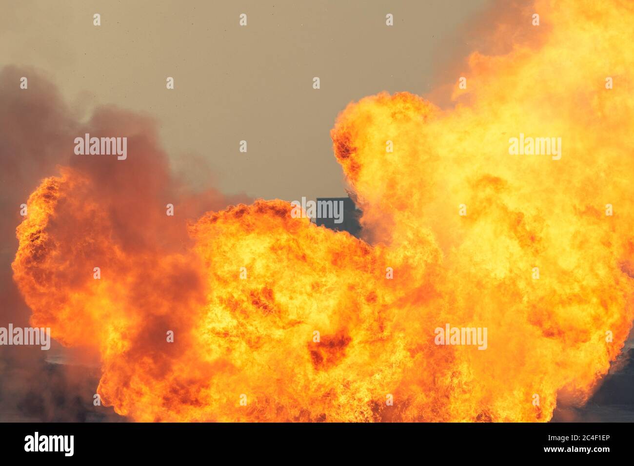 Massive fire explosion in military combat and war. Vehicle explosure ...